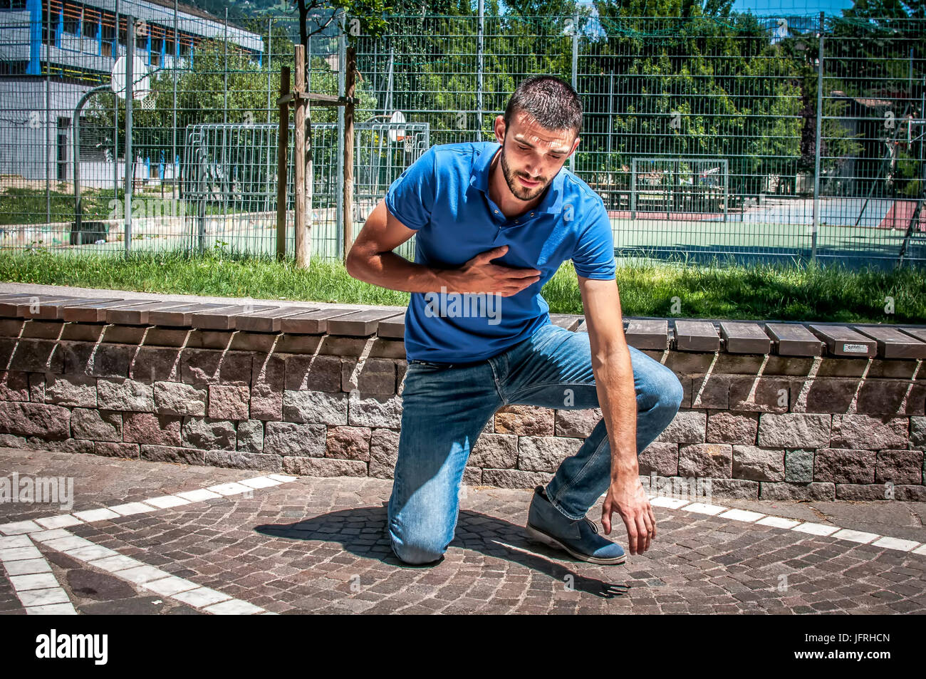 guy searching help during an heart attack Stock Photo - Alamy