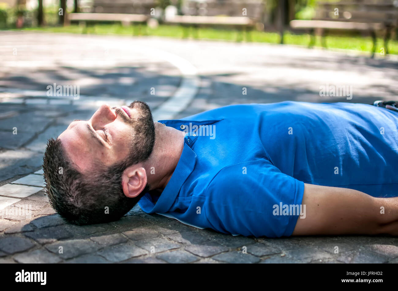 unconscious guy after heart attack in the outdoor Stock Photo - Alamy