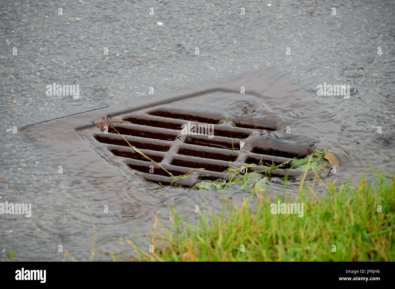 Water runs into a drain during heavy rainfall Stock Photo - Alamy Water runs into a drain during heavy rainfall Stock Photo - Alamy