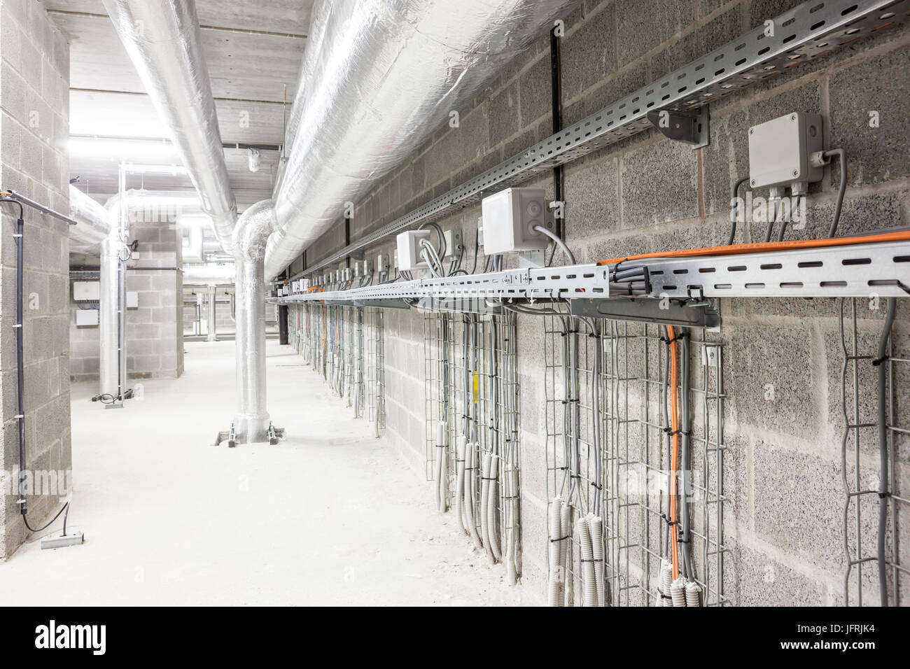 Electrical cables are located in a cableway in a building Stock Photo ...