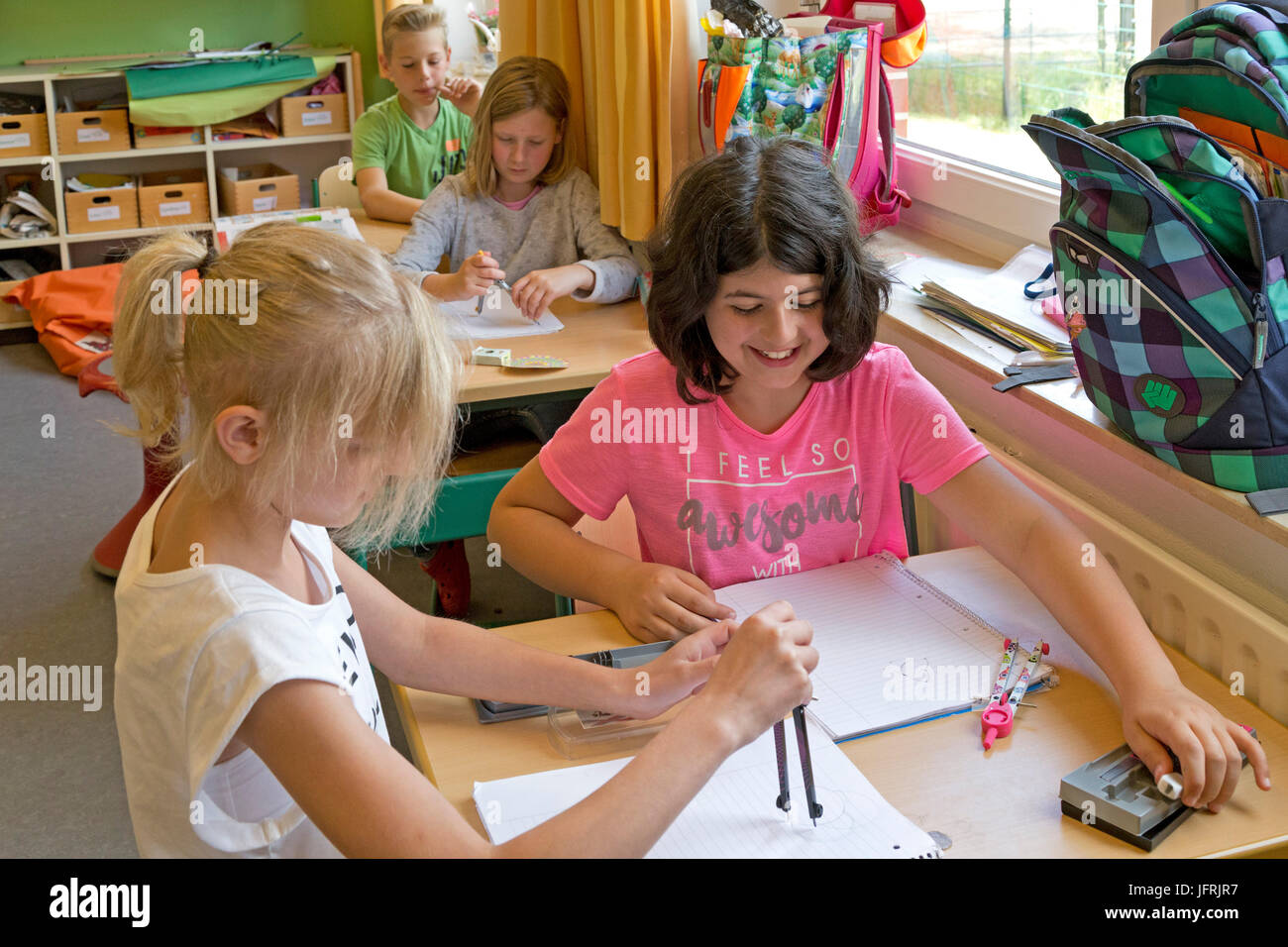 primary school children working with their compasses Stock Photo - Alamy