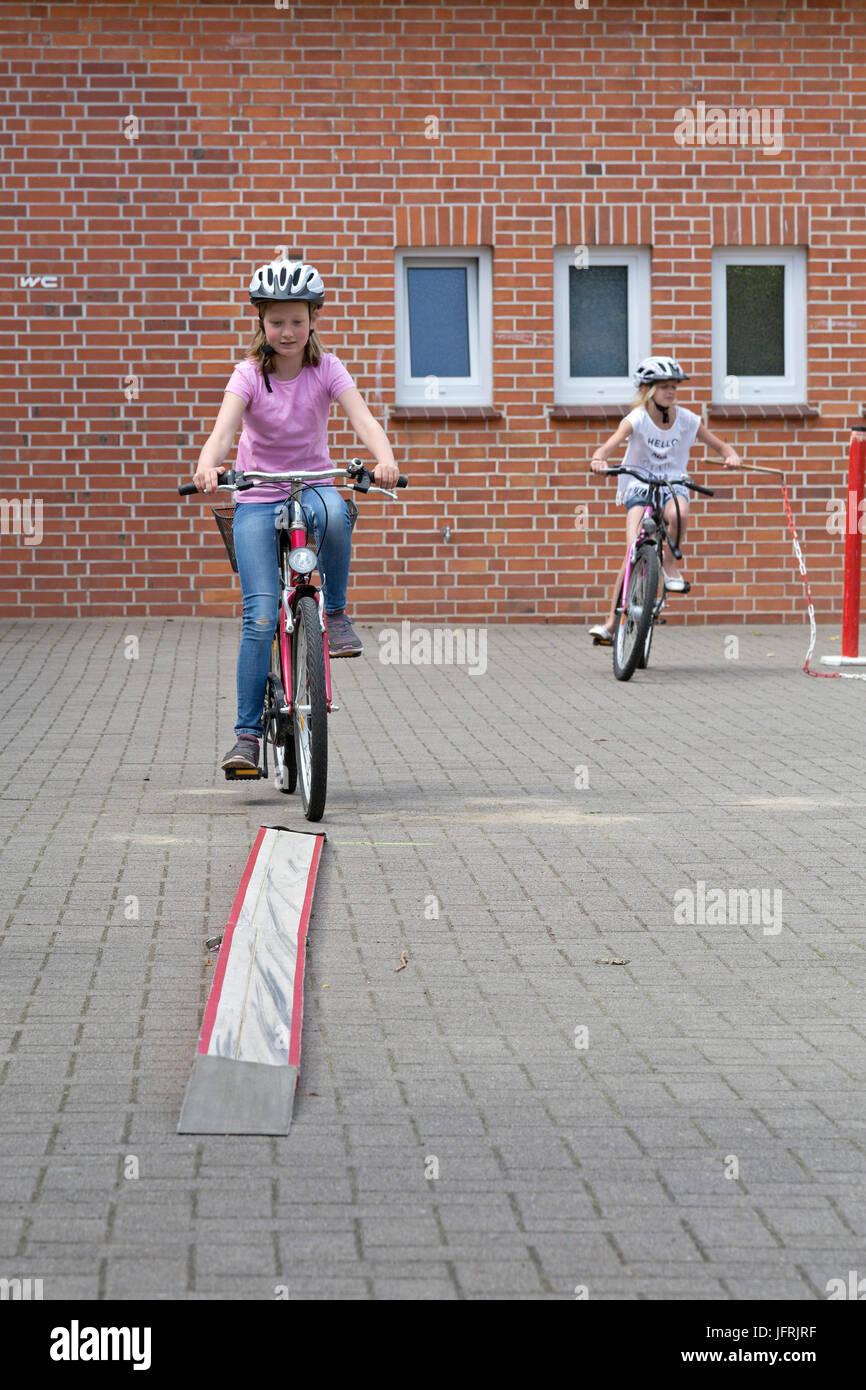 primary school girls during cycling lesson Stock Photo - Alamy