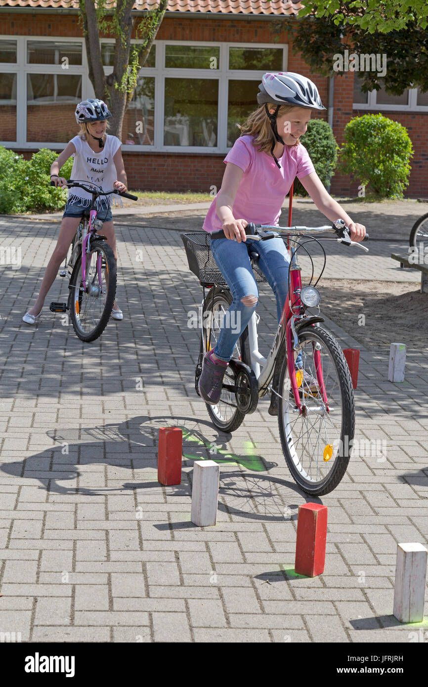 primary school girls during cycling lesson Stock Photo - Alamy