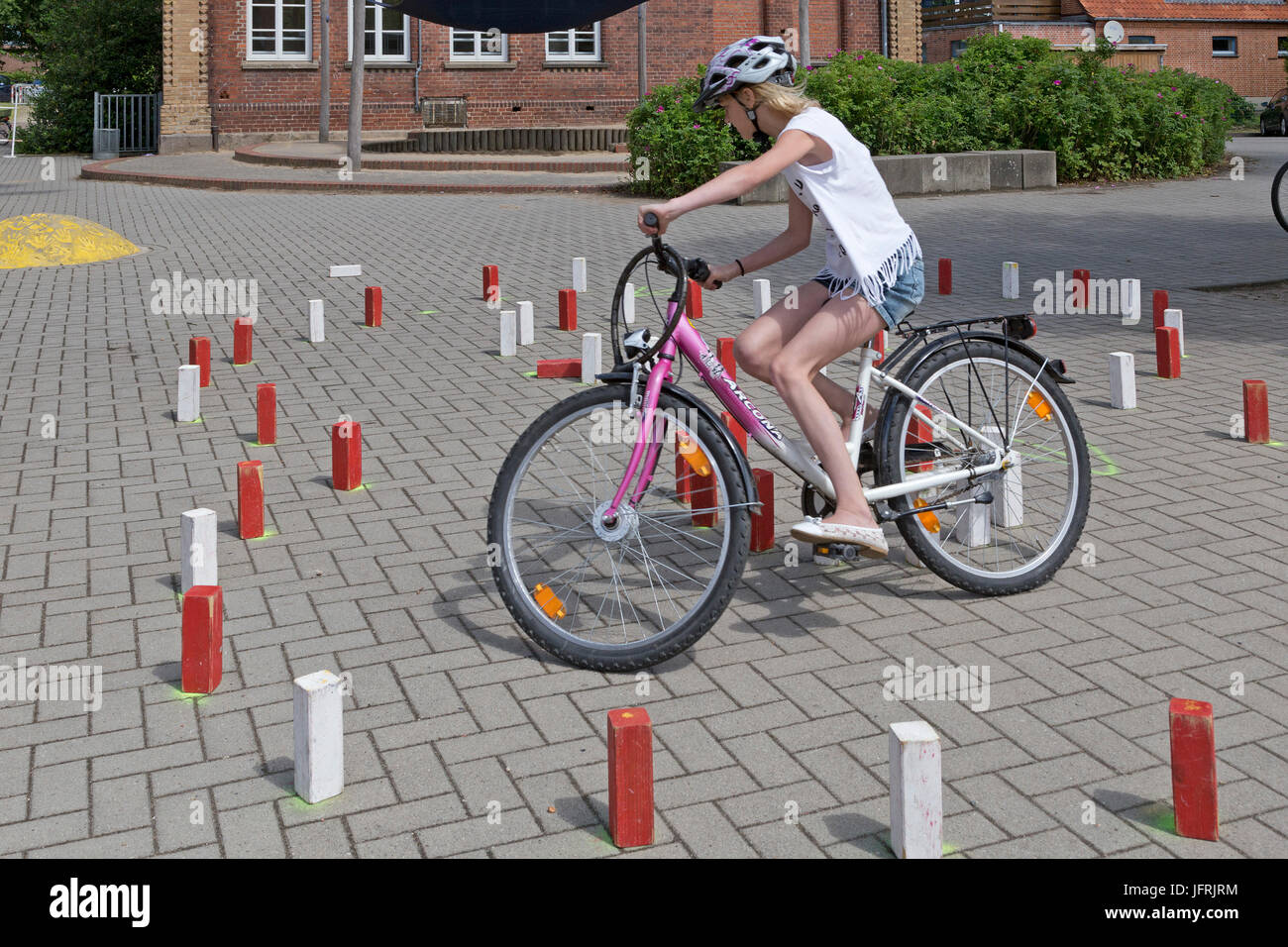 primary school girl during cycling lesson Stock Photo - Alamy