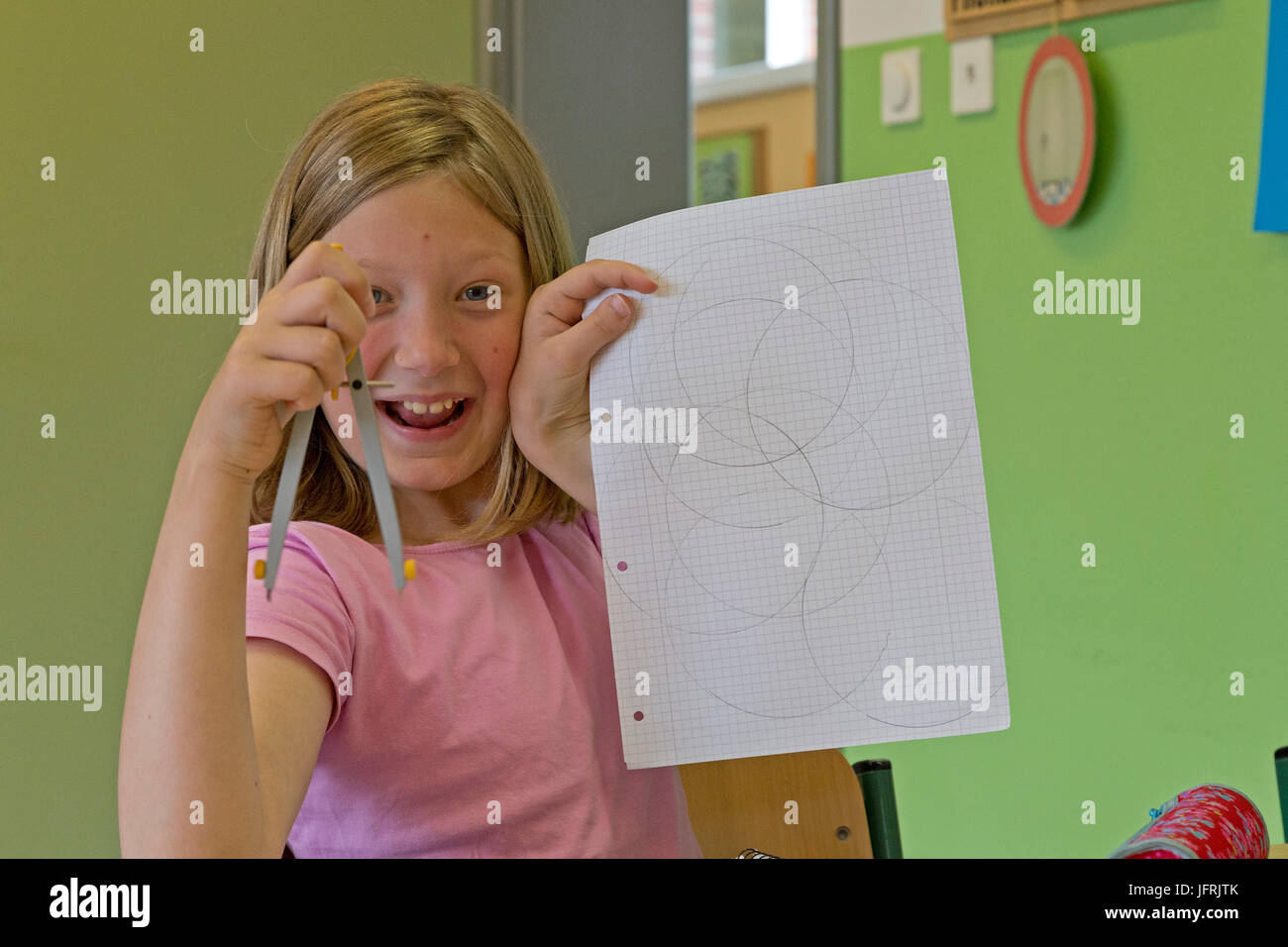 girls at primary school working with her compasses Stock Photo - Alamy