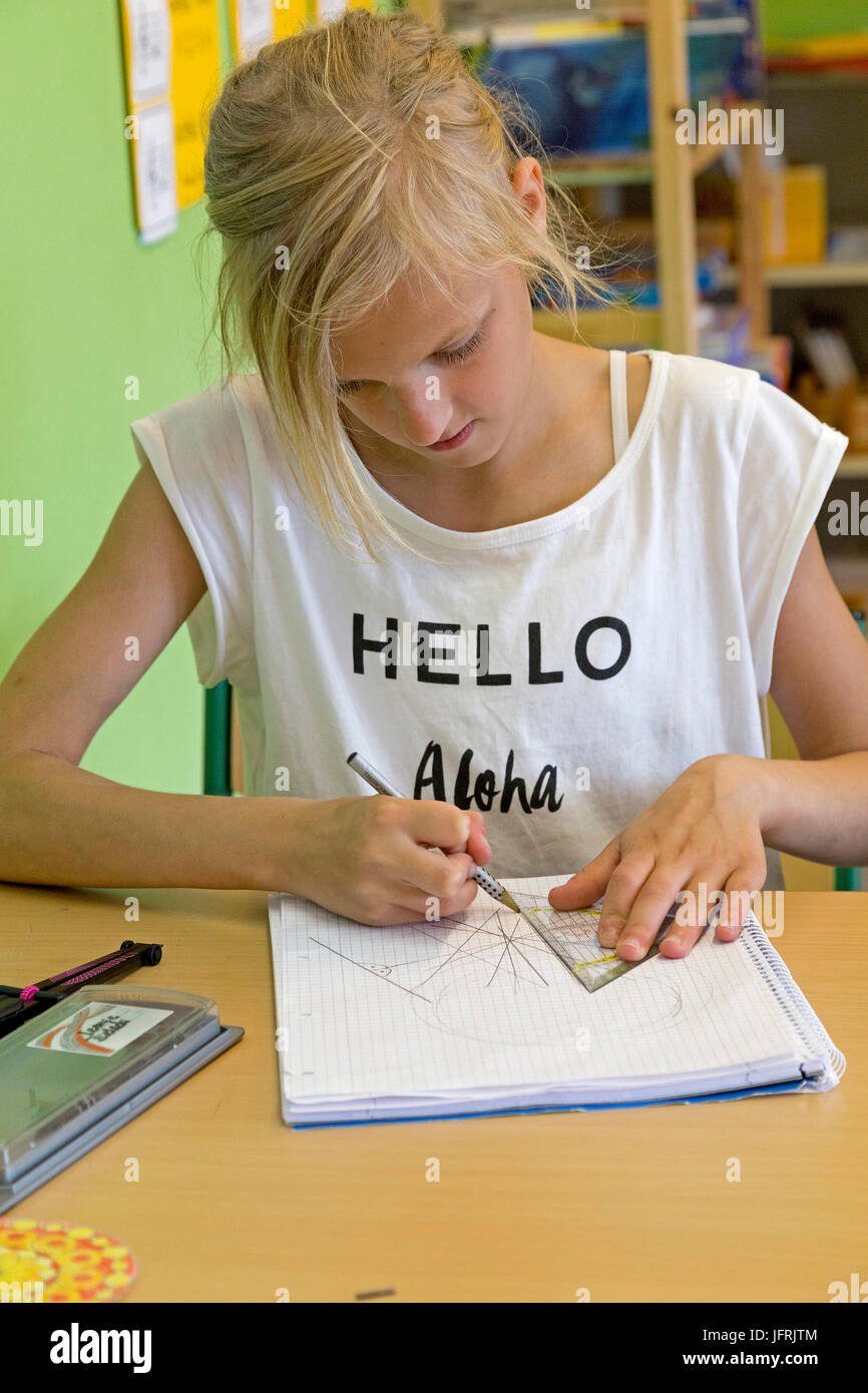 girl at primary school working with her square Stock Photo - Alamy