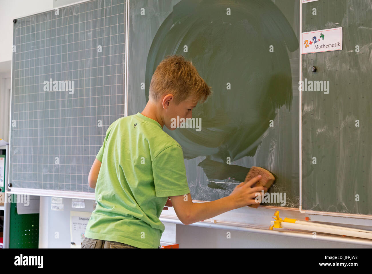 boy wiping the board at primary school Stock Photo - Alamy