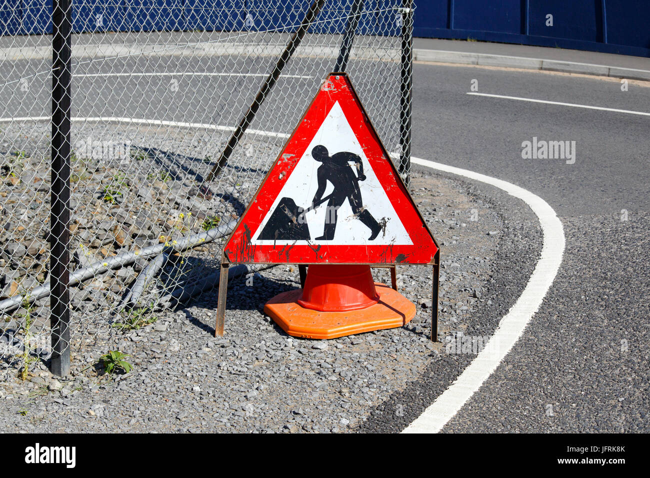Man digging road work sign hi-res stock photography and images - Alamy