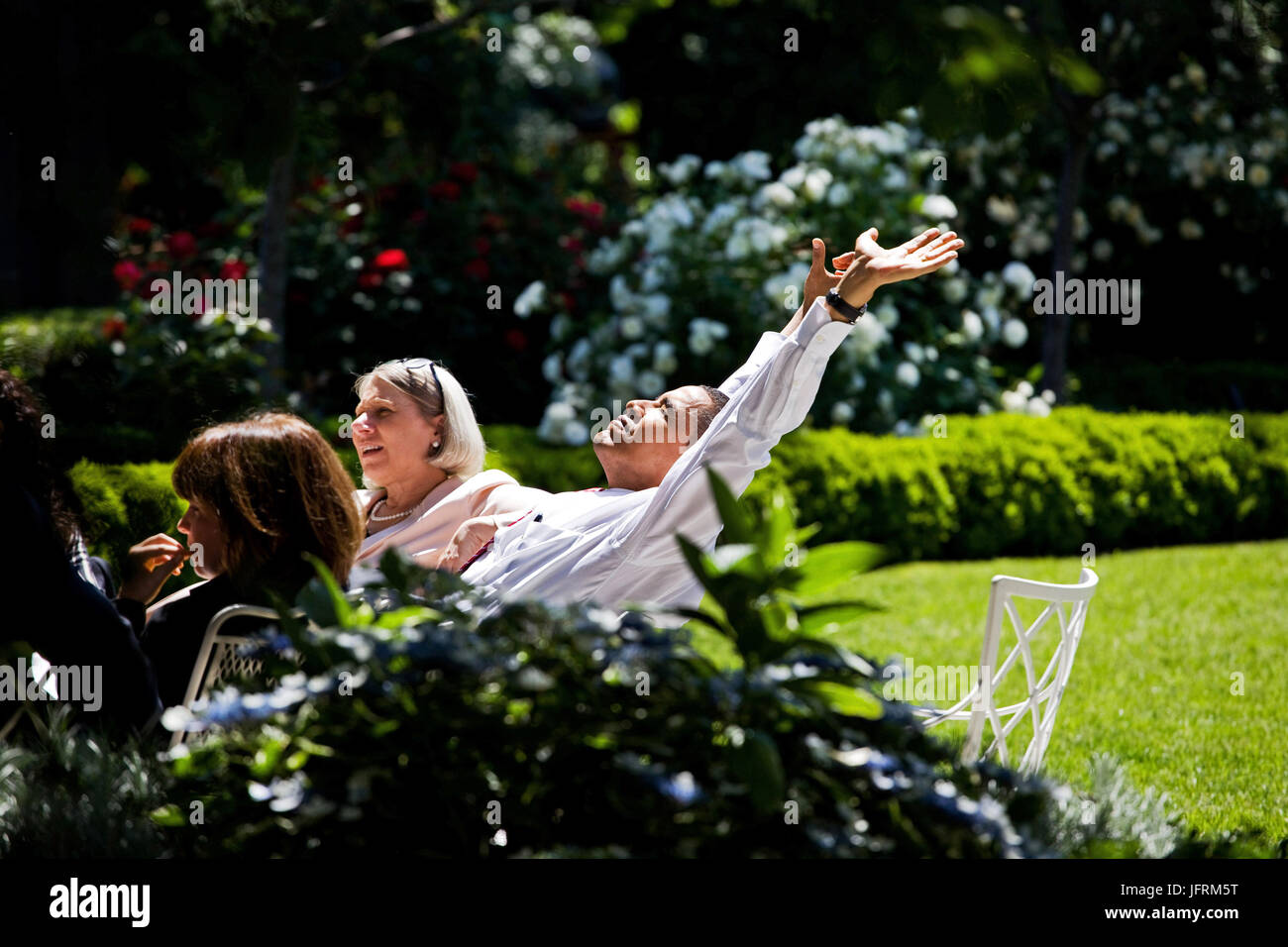 President Barack Obama stretches in the afternoon sun after moving his ...