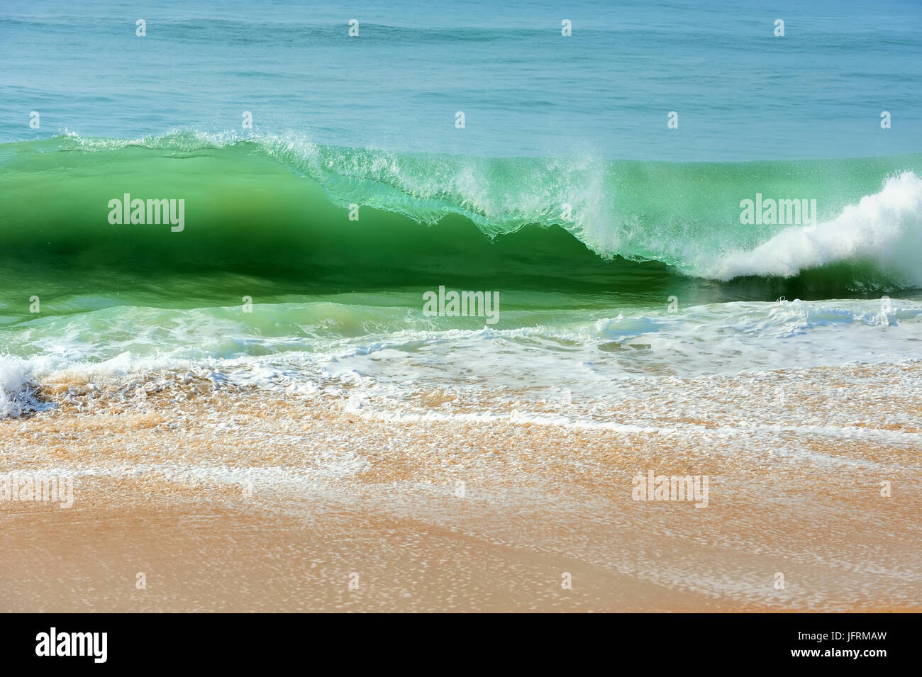 Wave of the ocean on the sand beach Stock Photo - Alamy