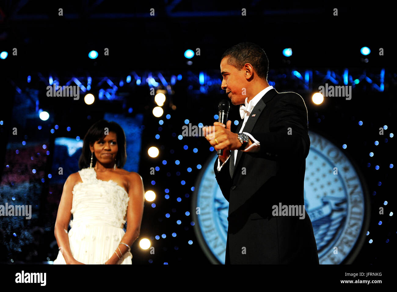 President Barack Obama, with first lady Michelle Obama by his side ...