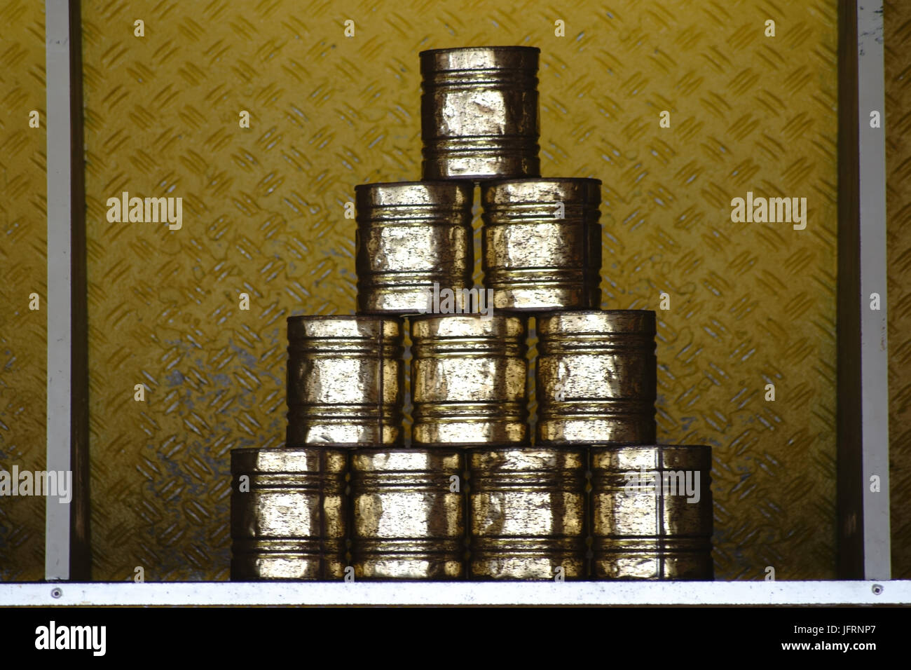 Stacked tin cans stacked on top of one tower and stacked on top of each ...