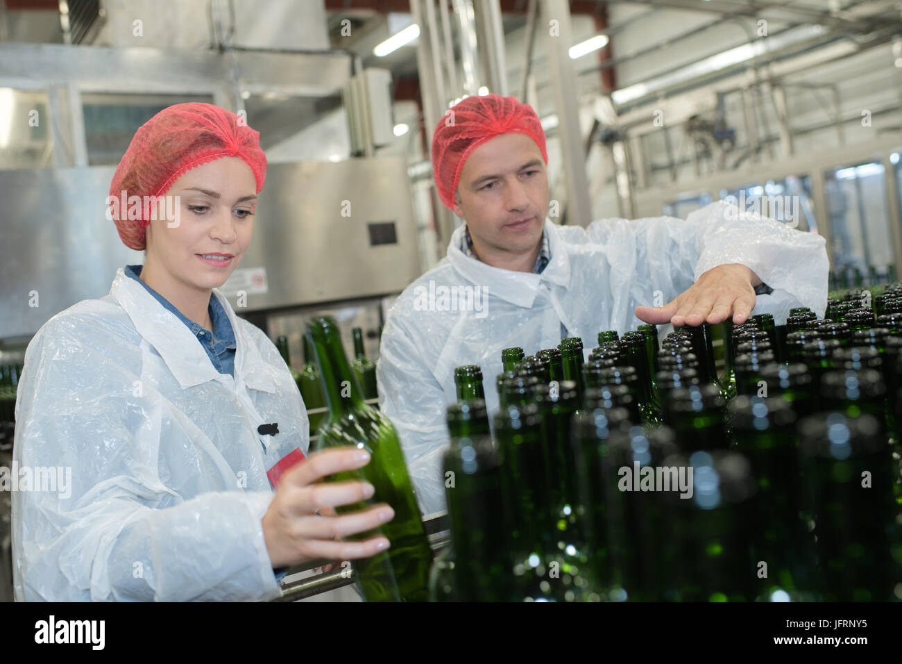 inspecting the bottles Stock Photo - Alamy