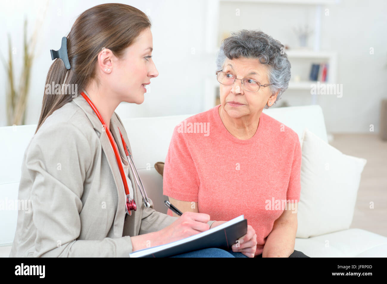 the nurse's visit in the house Stock Photo - Alamy