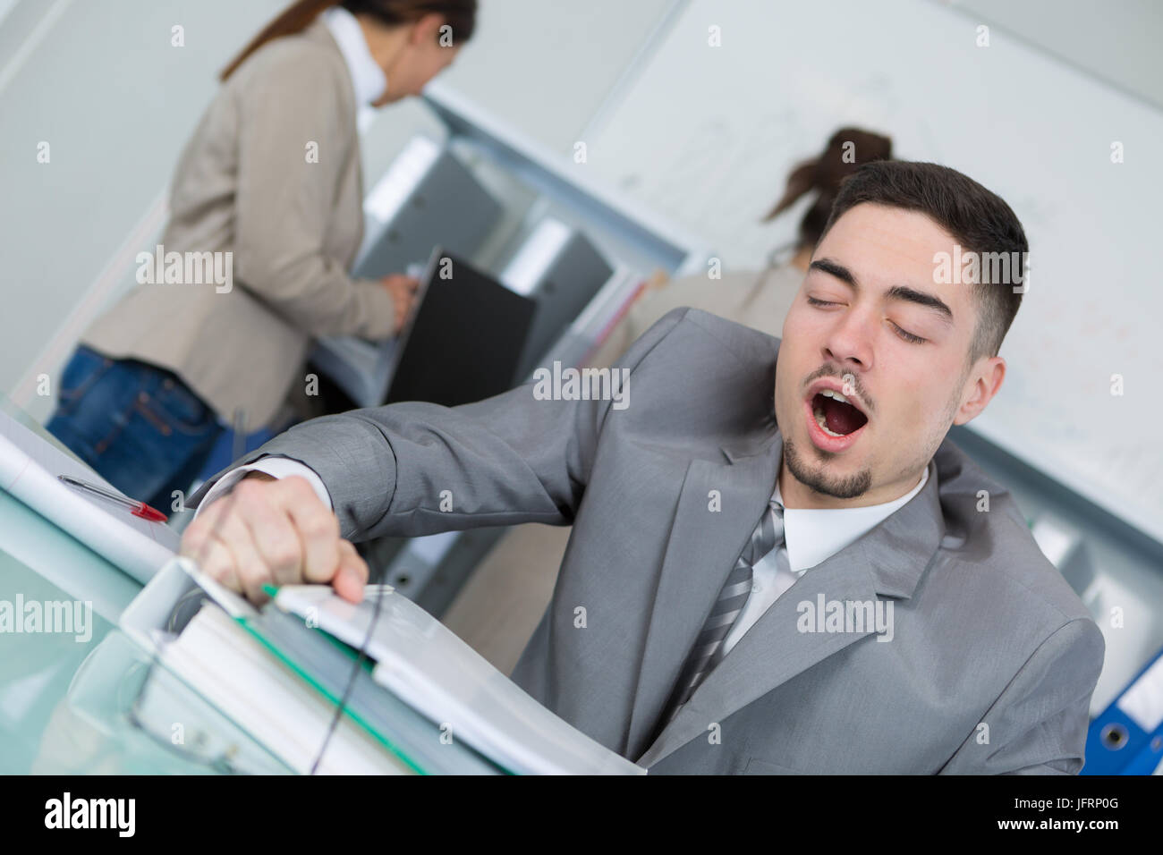 man tired at work Stock Photo - Alamy