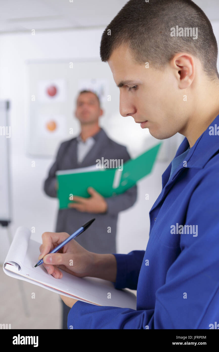 taking notes during the class Stock Photo - Alamy