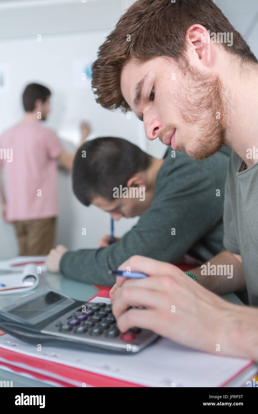 using a digital calculator Stock Photo - Alamy