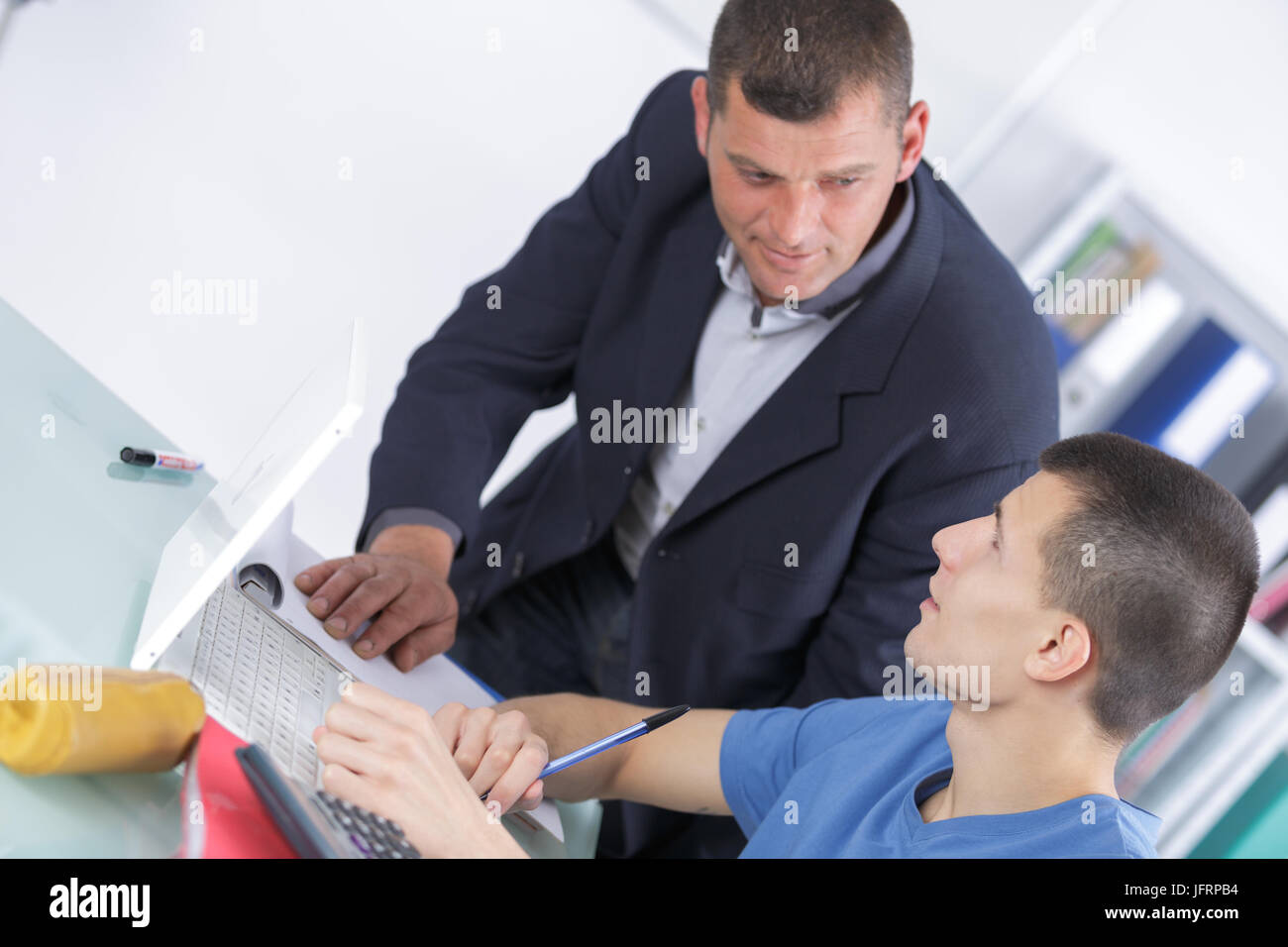 teacher and student during class Stock Photo - Alamy