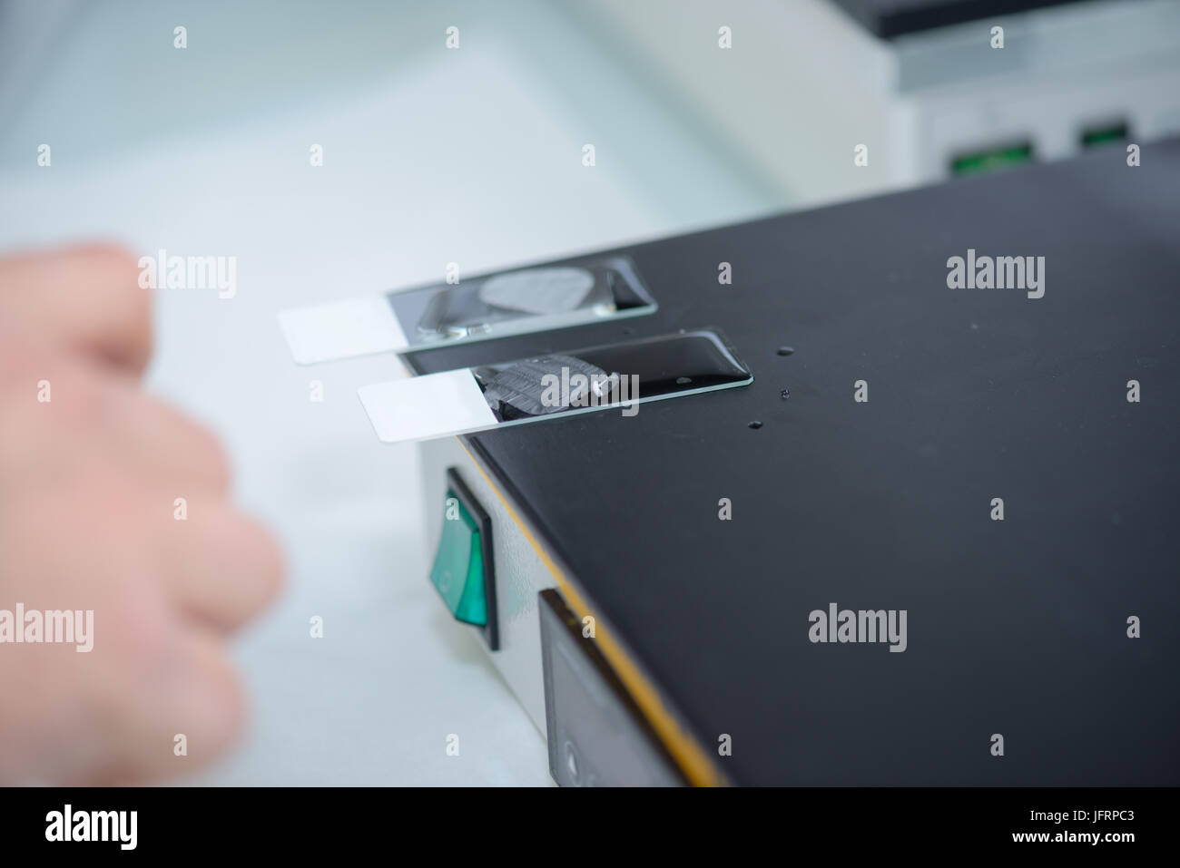 close up of male hand reaching electronic device Stock Photo - Alamy