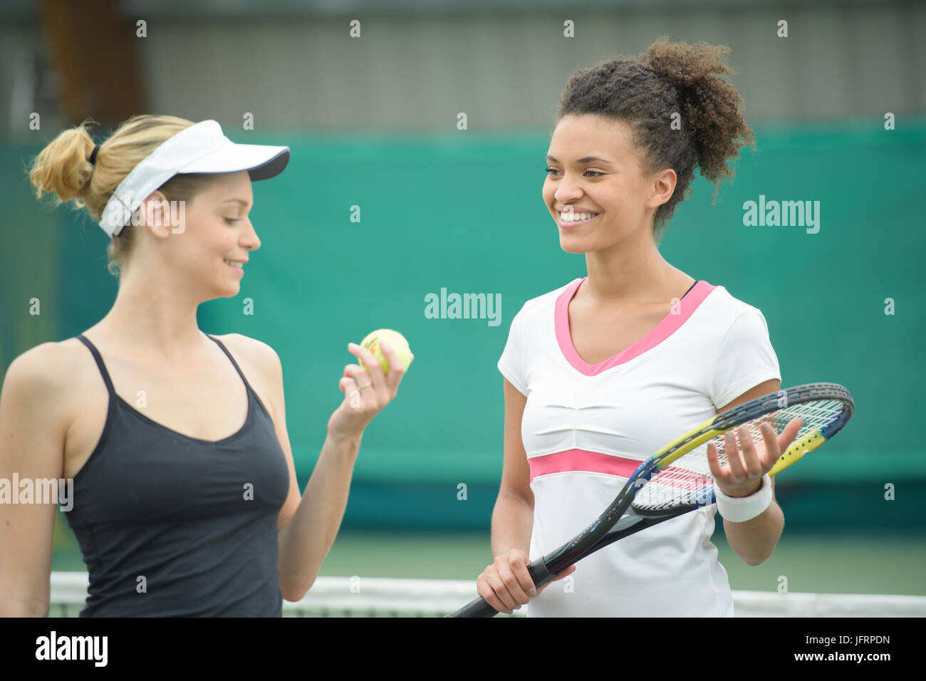Female tennis players playing doubles hi-res stock photography and ...