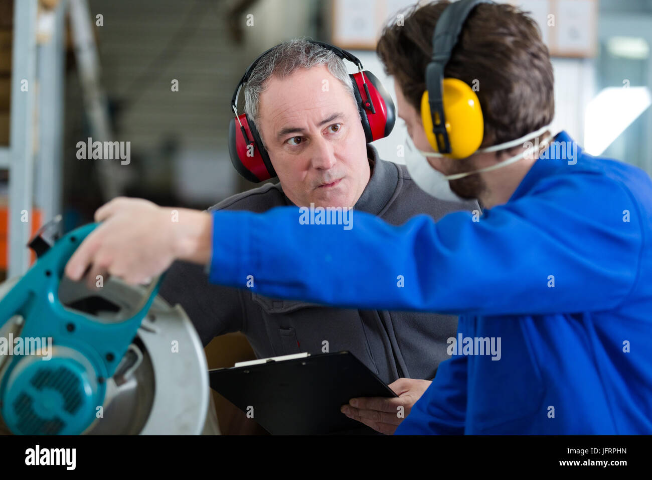 the worker operates the production equipment Stock Photo - Alamy