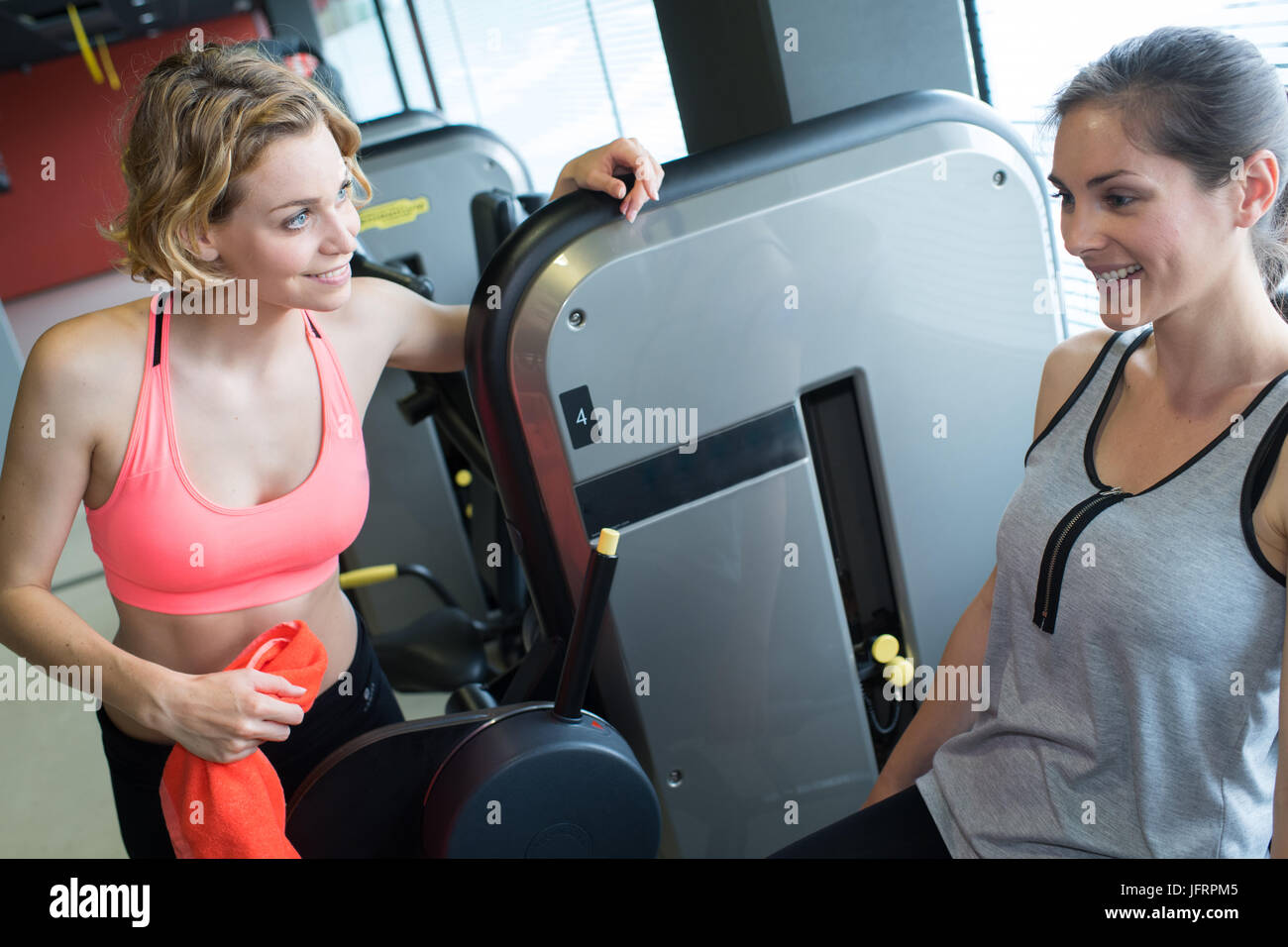 two female friends during workout at the gym Stock Photo - Alamy