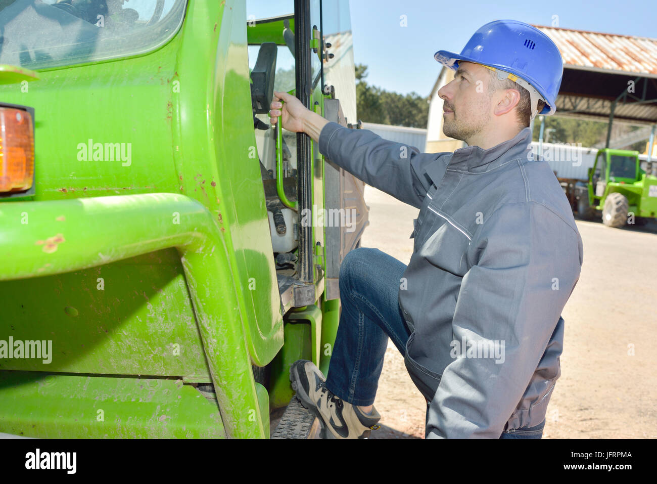Farmer climbing tractor hi-res stock photography and images - Alamy