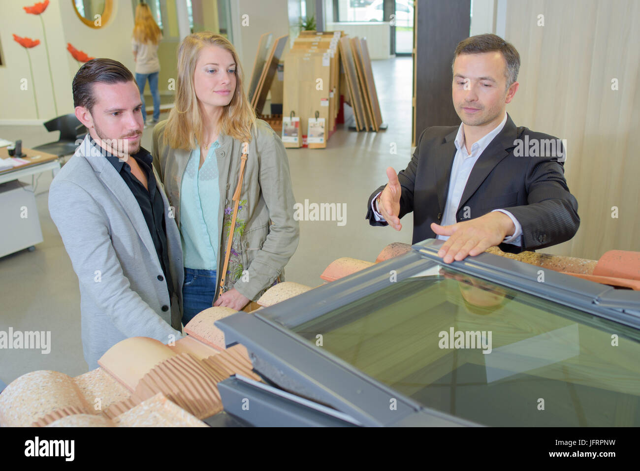 couple buying window with seller at store Stock Photo - Alamy