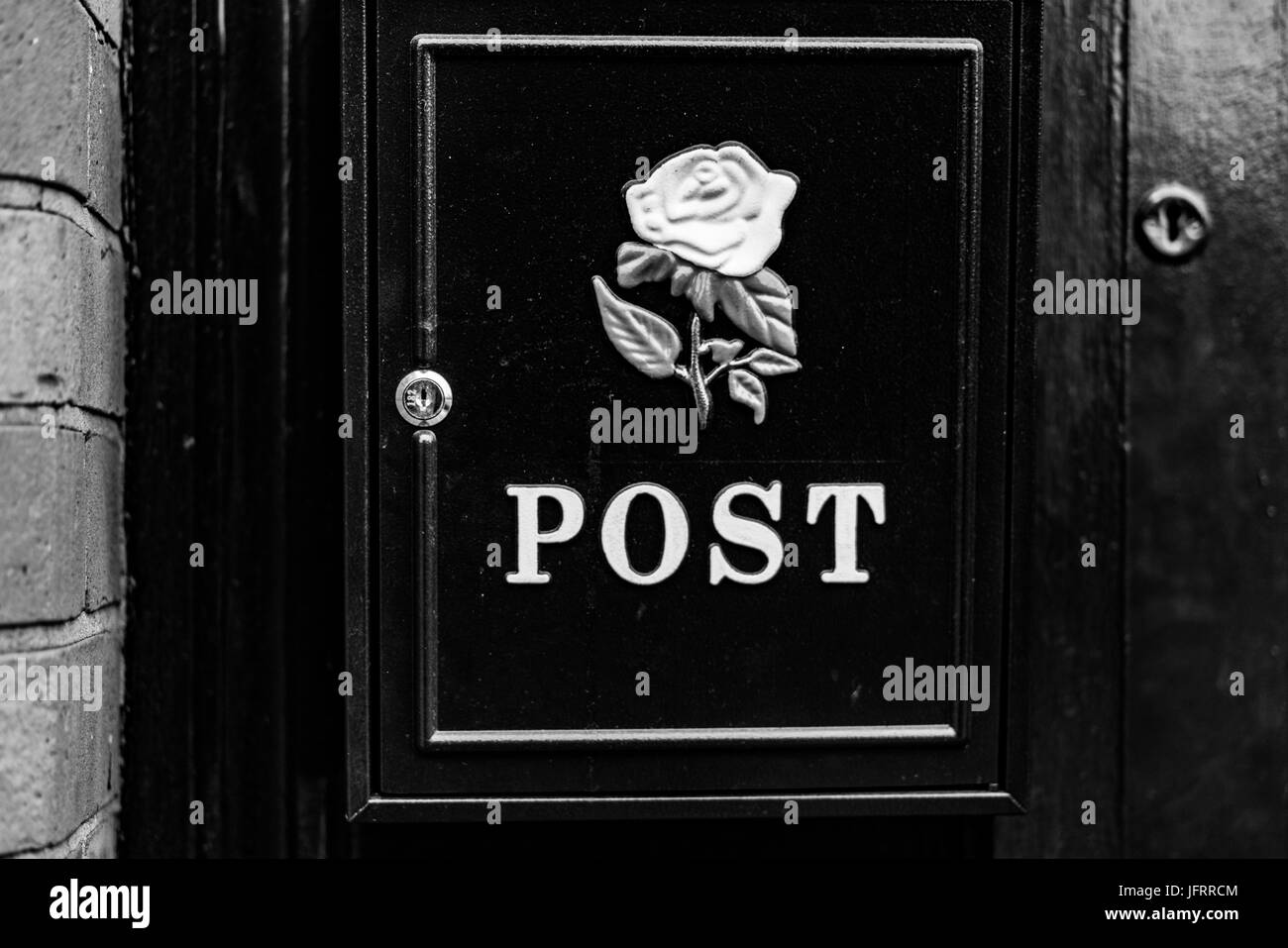 a mailbox with a white rose Stock Photo - Alamy