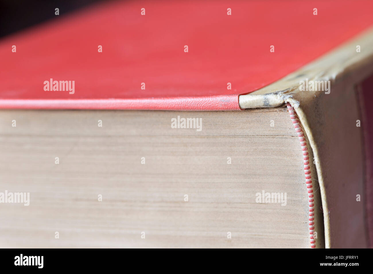 Detail of an old red book. Indoors shot Stock Photo - Alamy