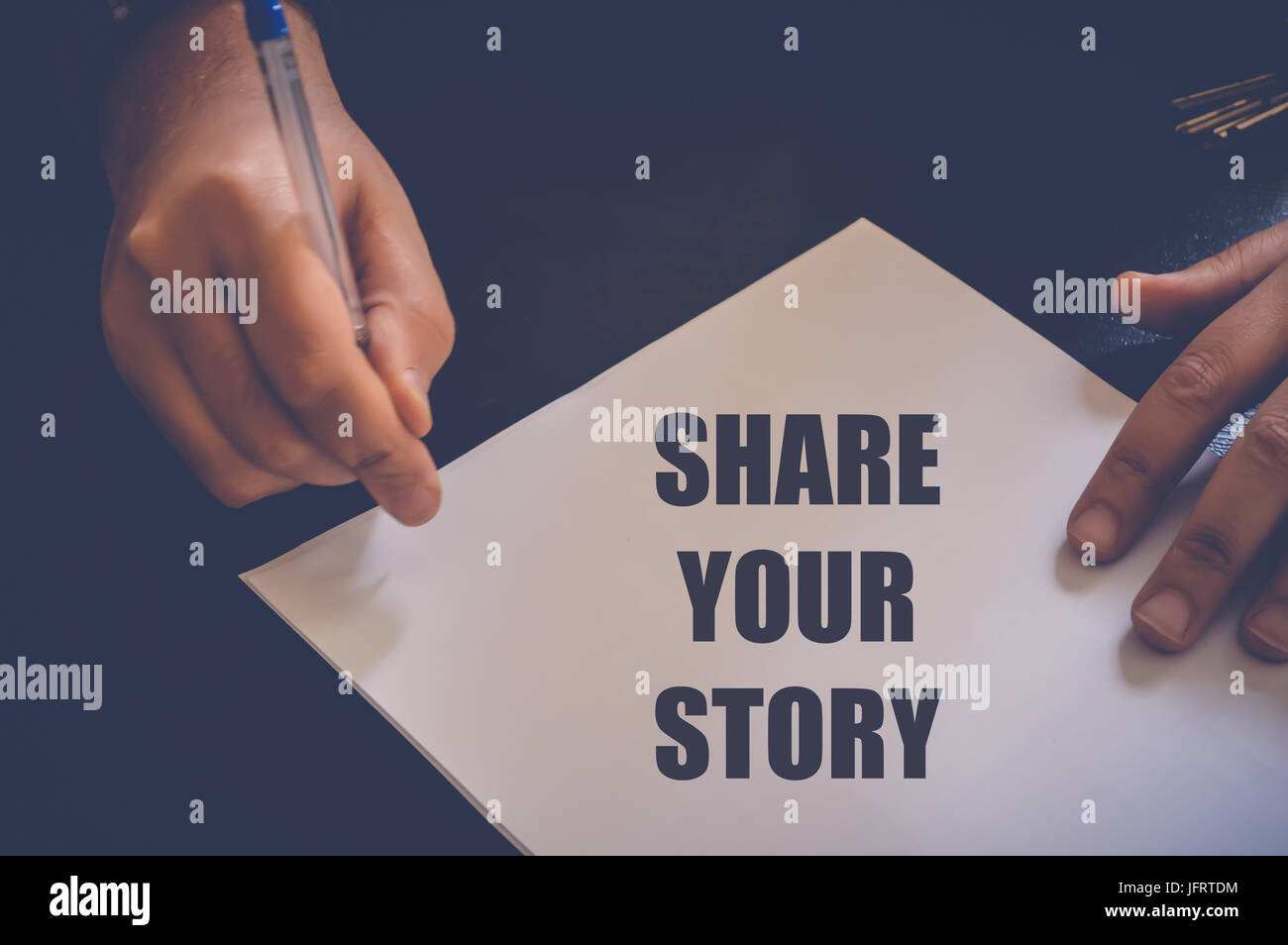 businessman write share your story on white paper Stock Photo - Alamy