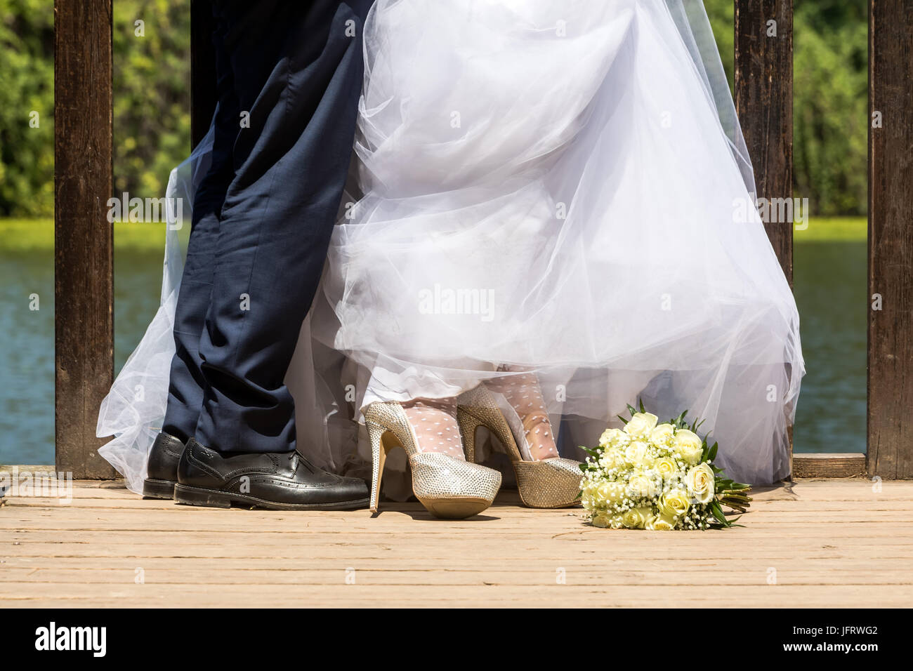 feet of bride and groom, wedding shoes Stock Photo - Alamy
