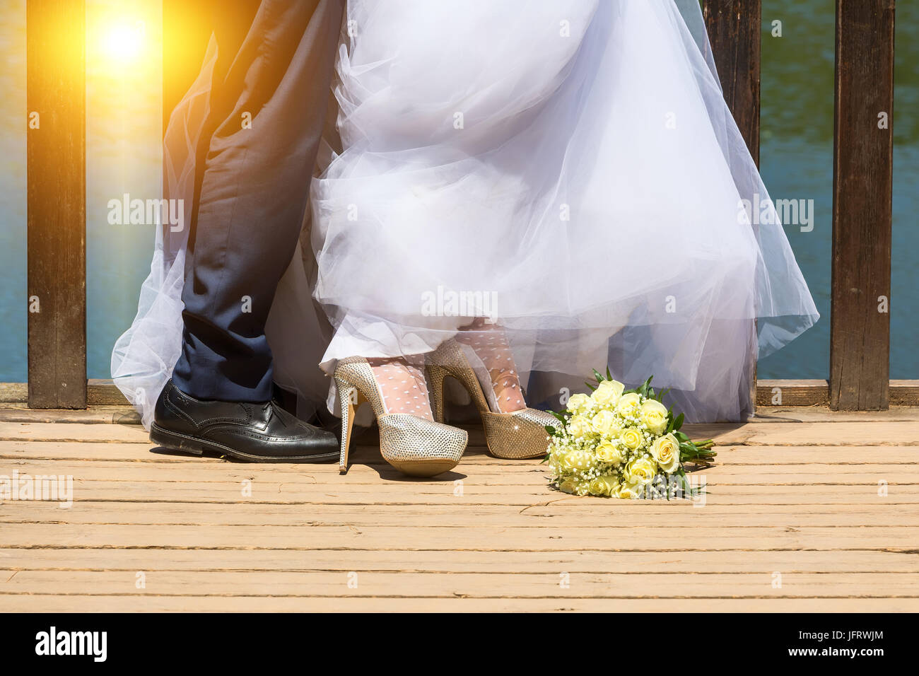 feet of bride and groom, wedding shoes Stock Photo - Alamy