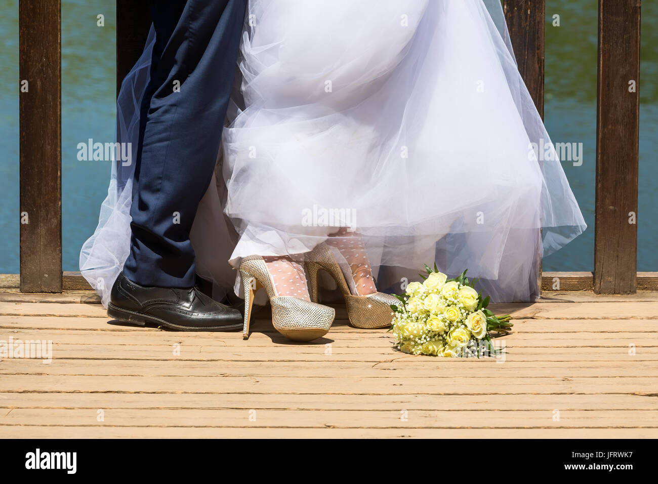 feet of bride and groom, wedding shoes. Soft focus Stock Photo - Alamy