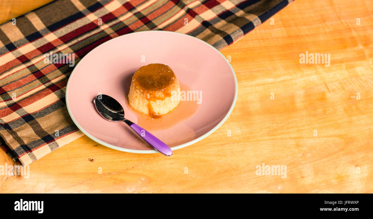 Flan or creme caramel pudding is a custard dessert with a layer of soft ...