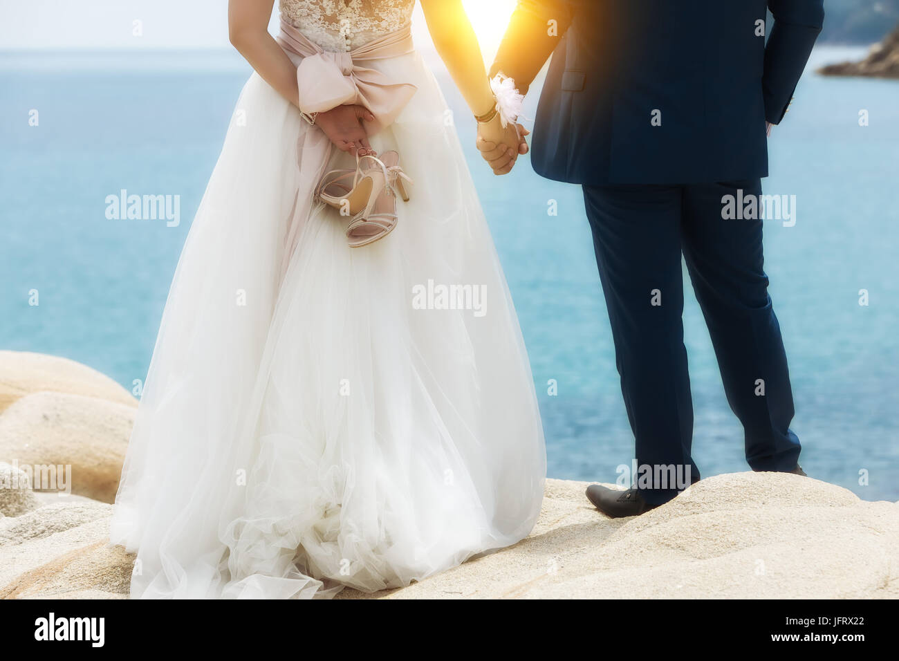 feet of bride and groom, wedding shoes. Soft focus Stock Photo - Alamy