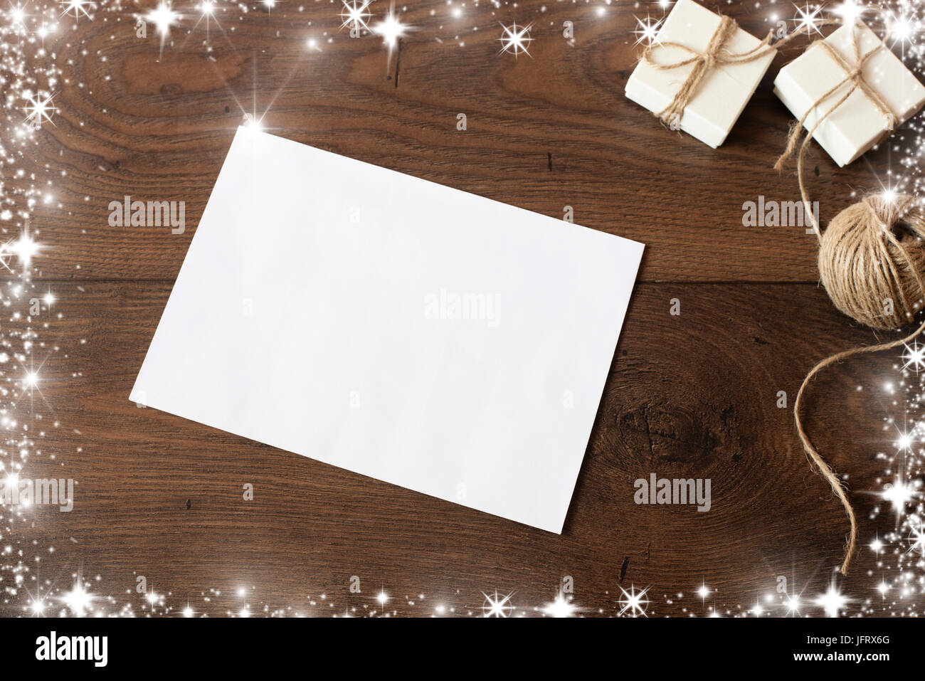 Christmas letter writing on white paper on wooden background with ...