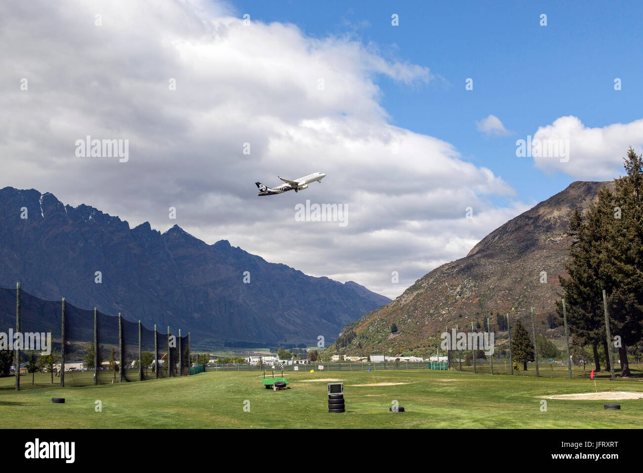 Airplane taking off at Queenstown Airport Stock Photo - Alamy