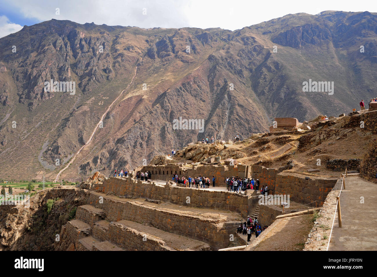 Above the town of Ollantaytambo tower the well-preserved remains of the ...