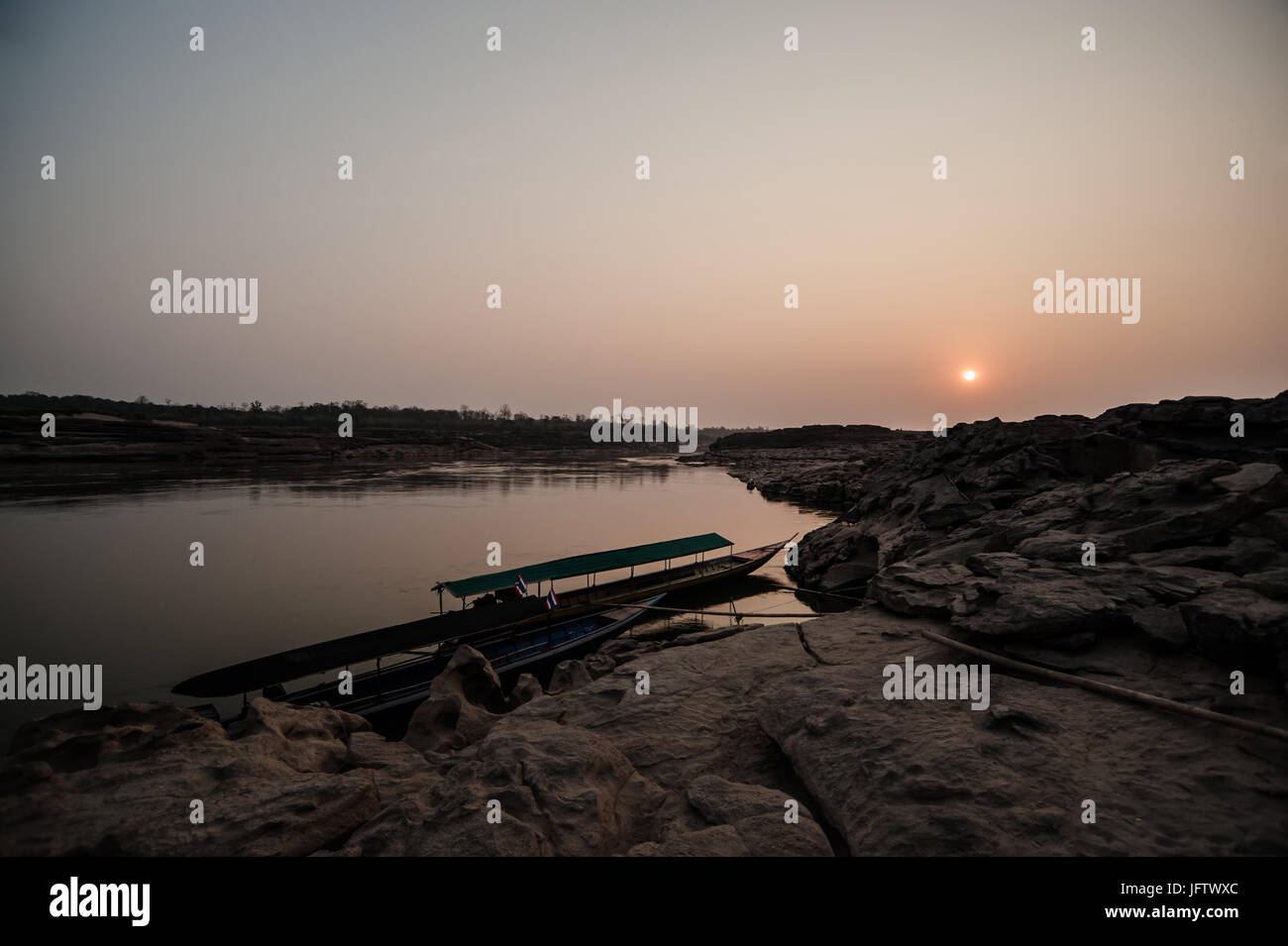 Longtail boat, Berth at sand Sam Pan Bok Grand Canyon in Maekhong river ...