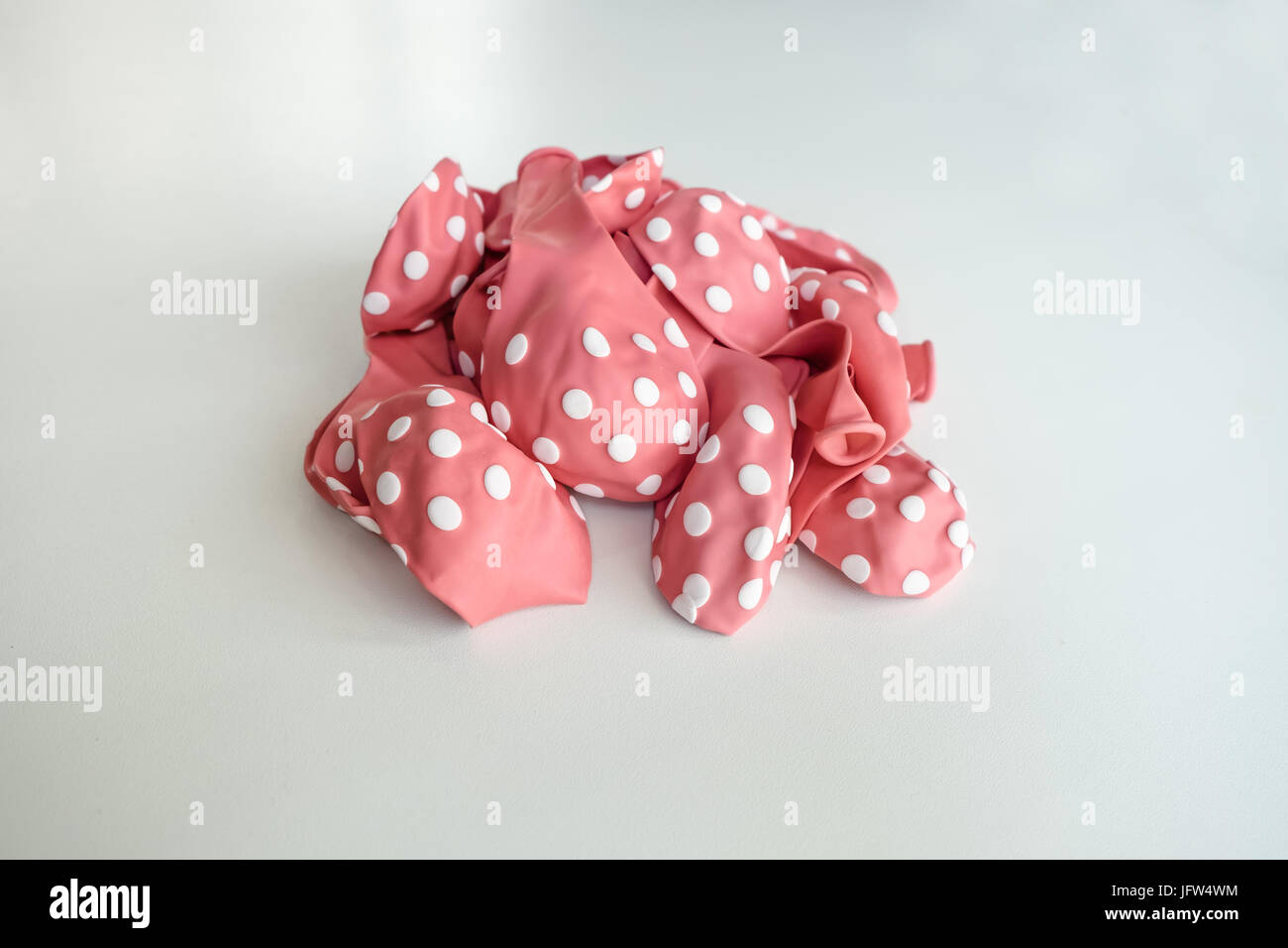 Deflated red balloon hi-res stock photography and images - Alamy