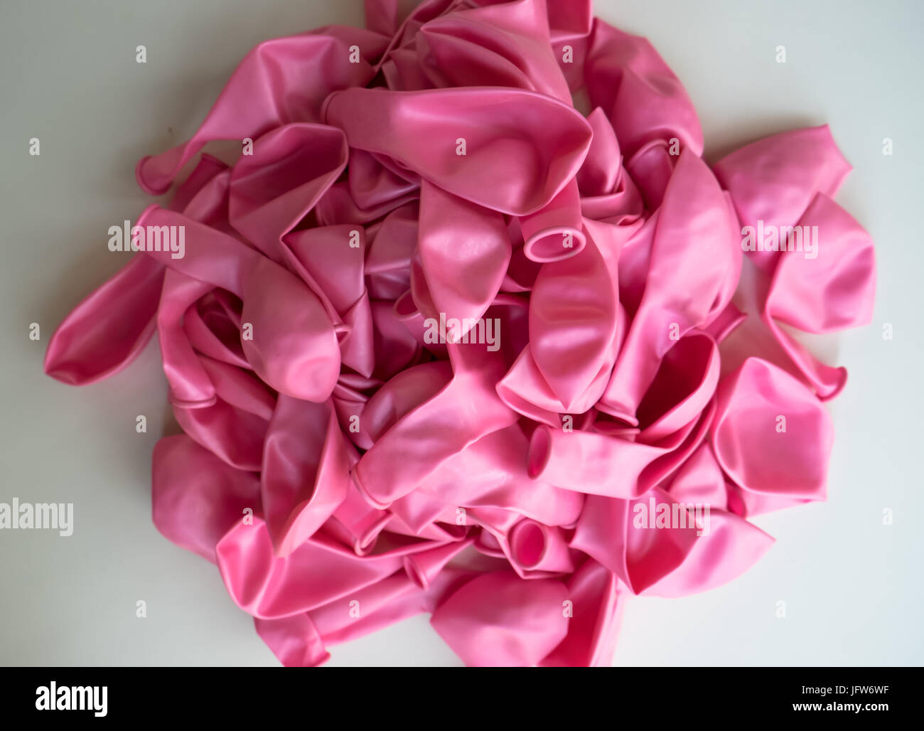 Deflated green with rubber air balloon isolated over the white ...