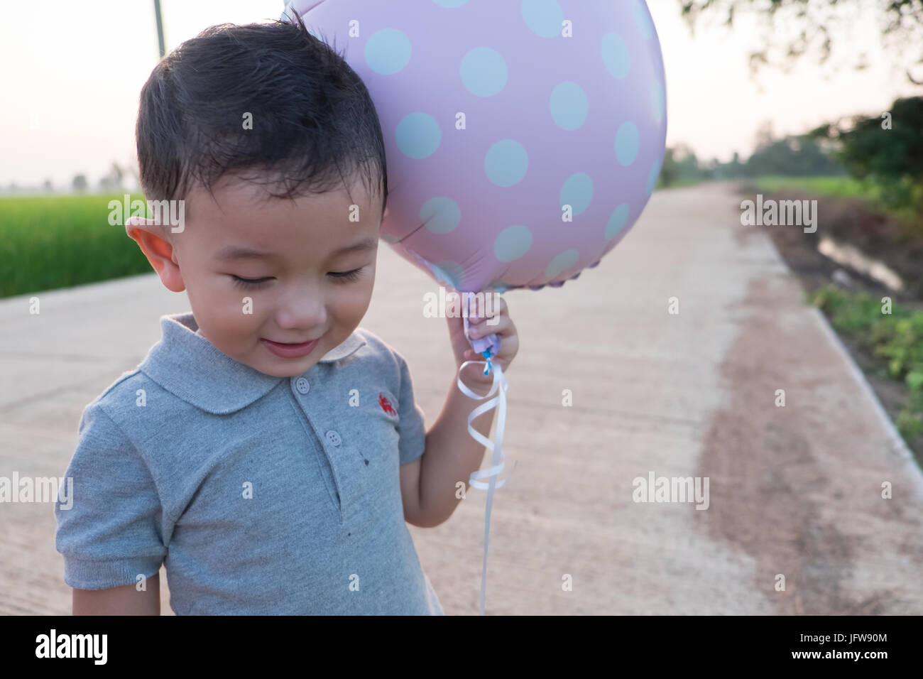 KAMPHAENG PHET, THAILAND - OCTOBER 26 : Happy Baby play with balloons ...