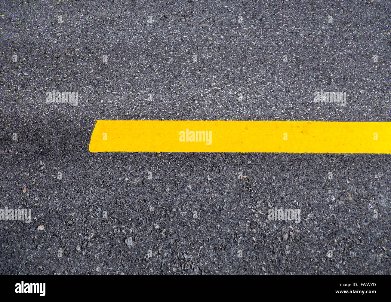 Close up asphalt surface of road divide yellow lines Stock Photo - Alamy