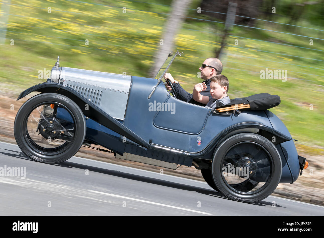 Vintage 1946 Austin 16 Sedan driving on country roads near the town of ...