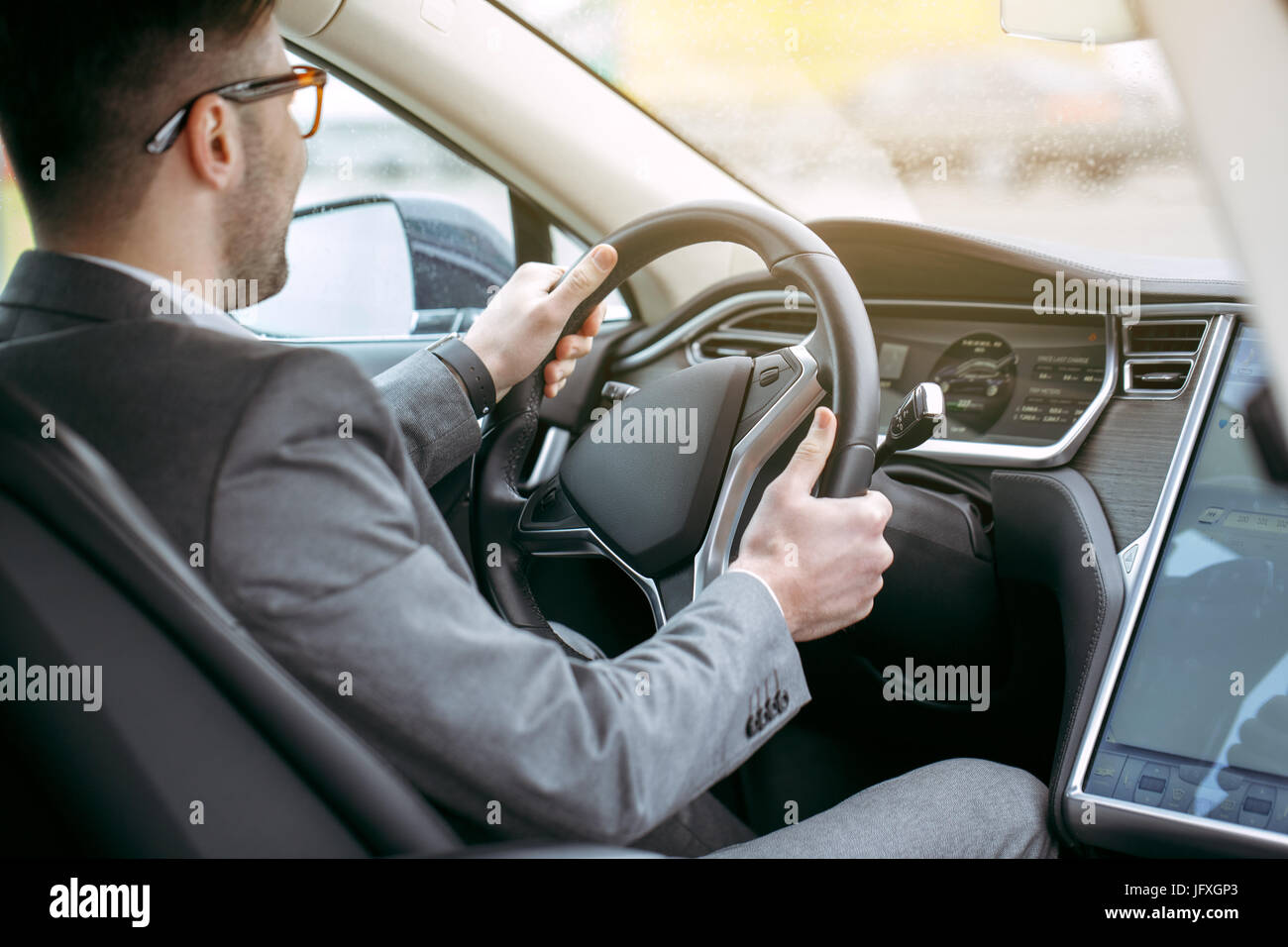 Businessman car smiling steering wheel hi-res stock photography and ...