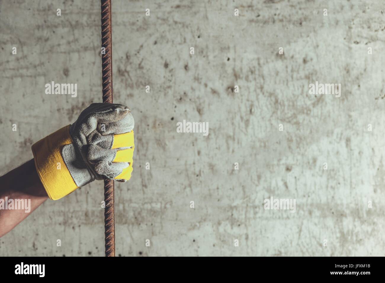 Concrete Reinforcement Concept Photo. Reinforcement Rod in a Hand of ...