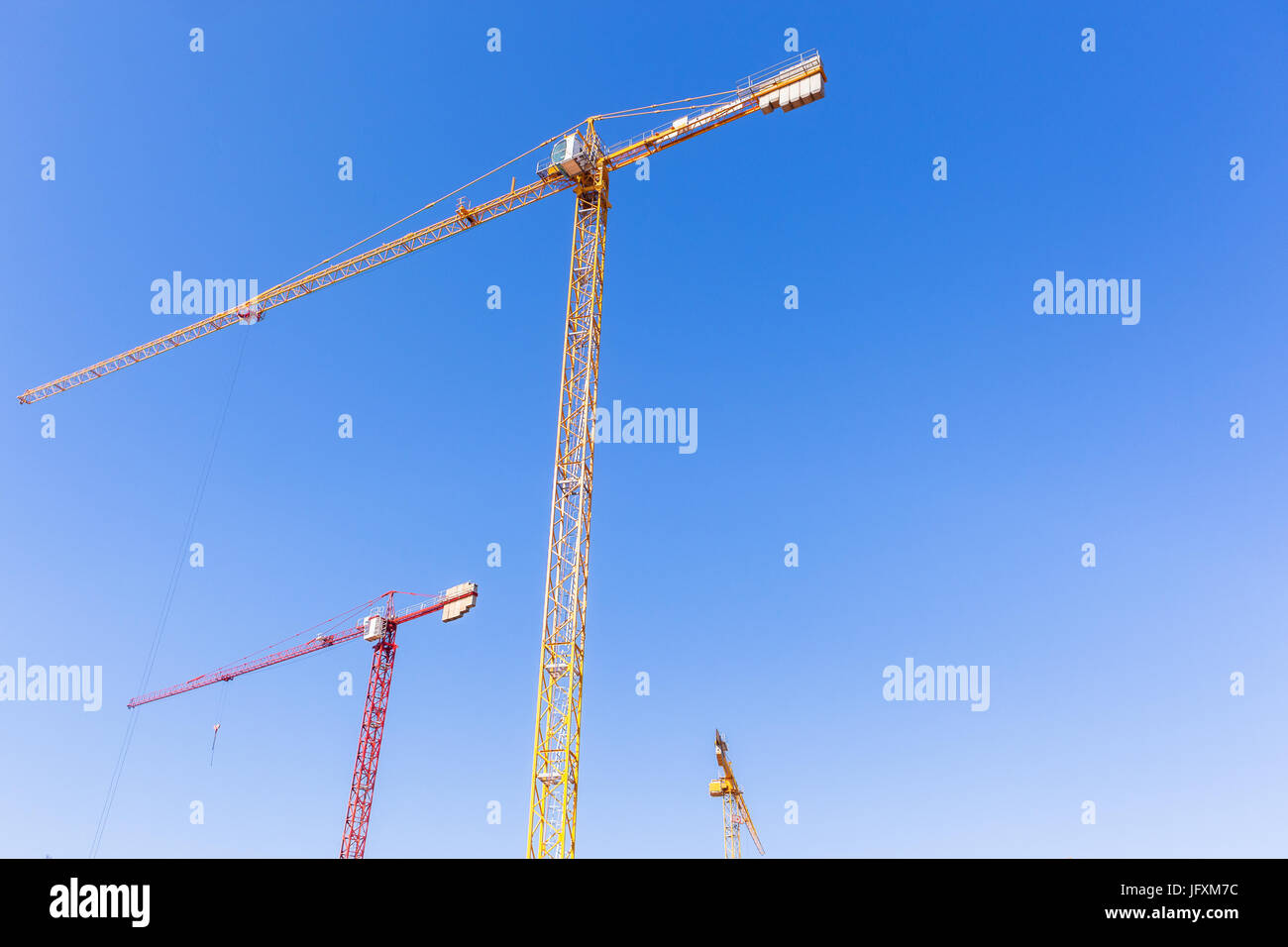 Building construction site cranes hoisting rigging machines high ...