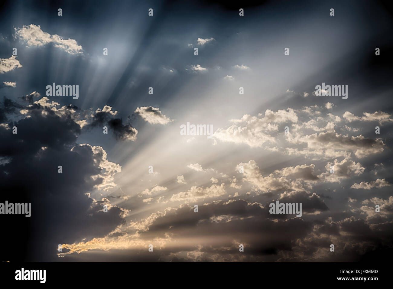in the empty sky lots of clouds and sunny ray of light Stock Photo - Alamy