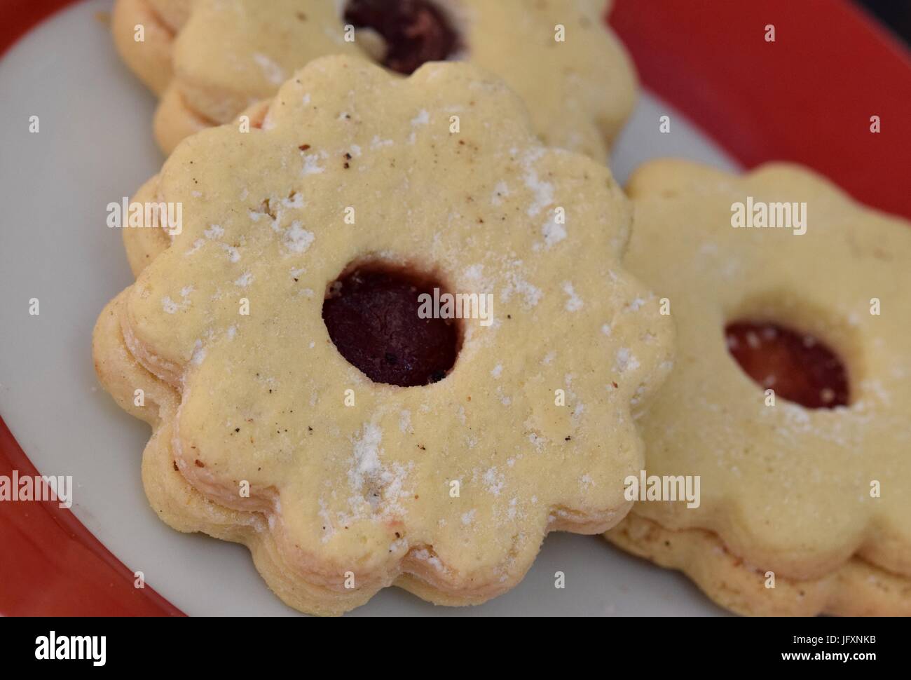 Macro view on the crisp cookie with plum jam inside Stock Photo - Alamy